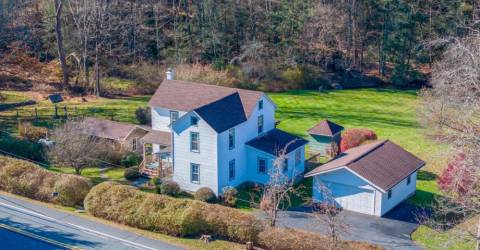 Brook-front farmhouse has lots of character