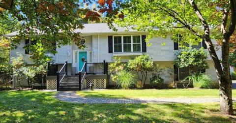 Updated raised ranch offers lake and beach access