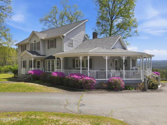 Live and work from this home with panoramic views, pond and pool