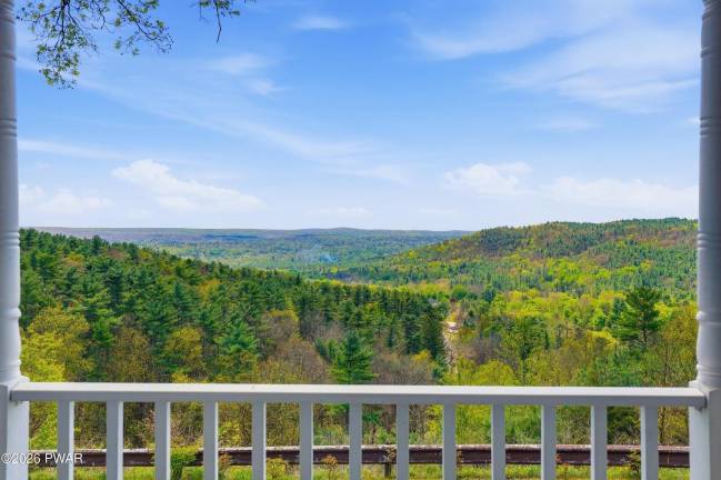 Live and work from this home with panoramic views, pond and pool